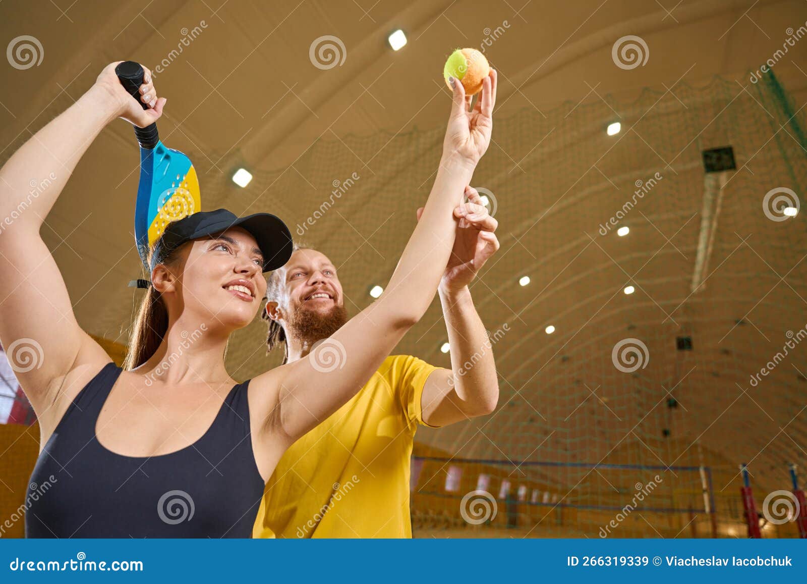 Man Corrects Position of Hand of Tennis Player with Ball Stock Image ...