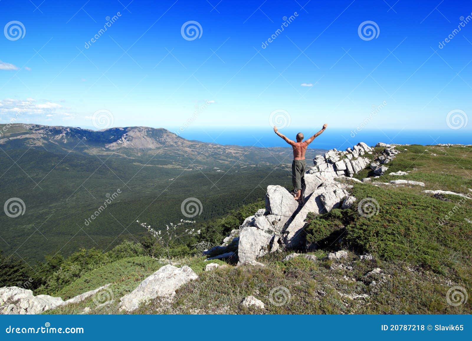 Man Costs on a Rock, Having Lifted Upwards Hands Stock Photo - Image of ...