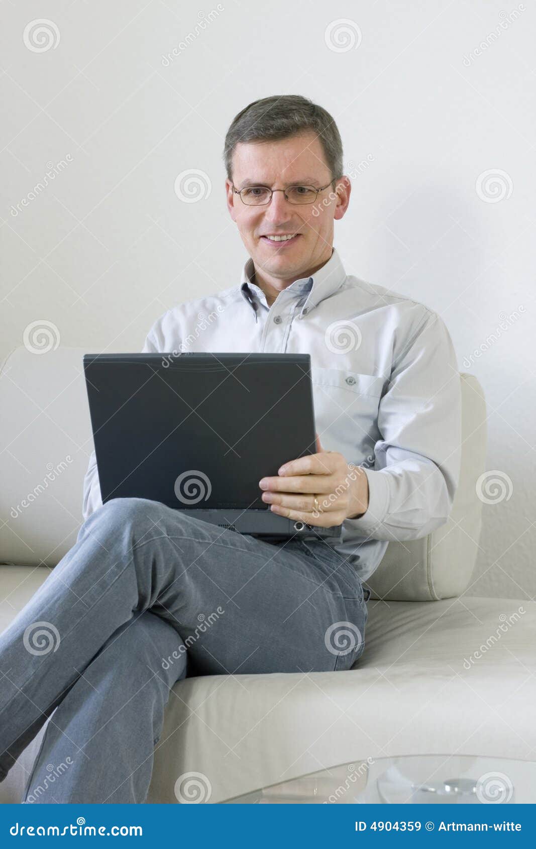 Man on Couch with Laptop Computer Stock Image - Image of play, aged ...