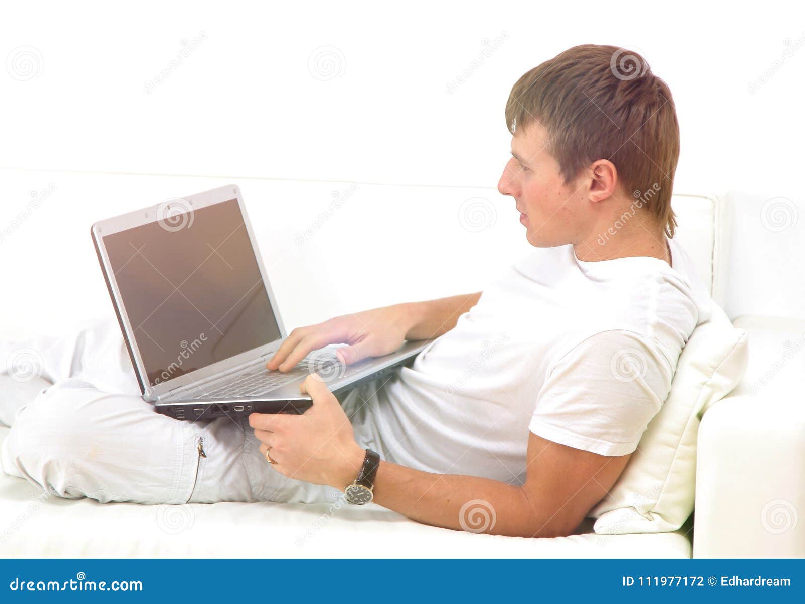 Very Focused Young Man Using Laptop while Sitting Comfortably. Stock ...
