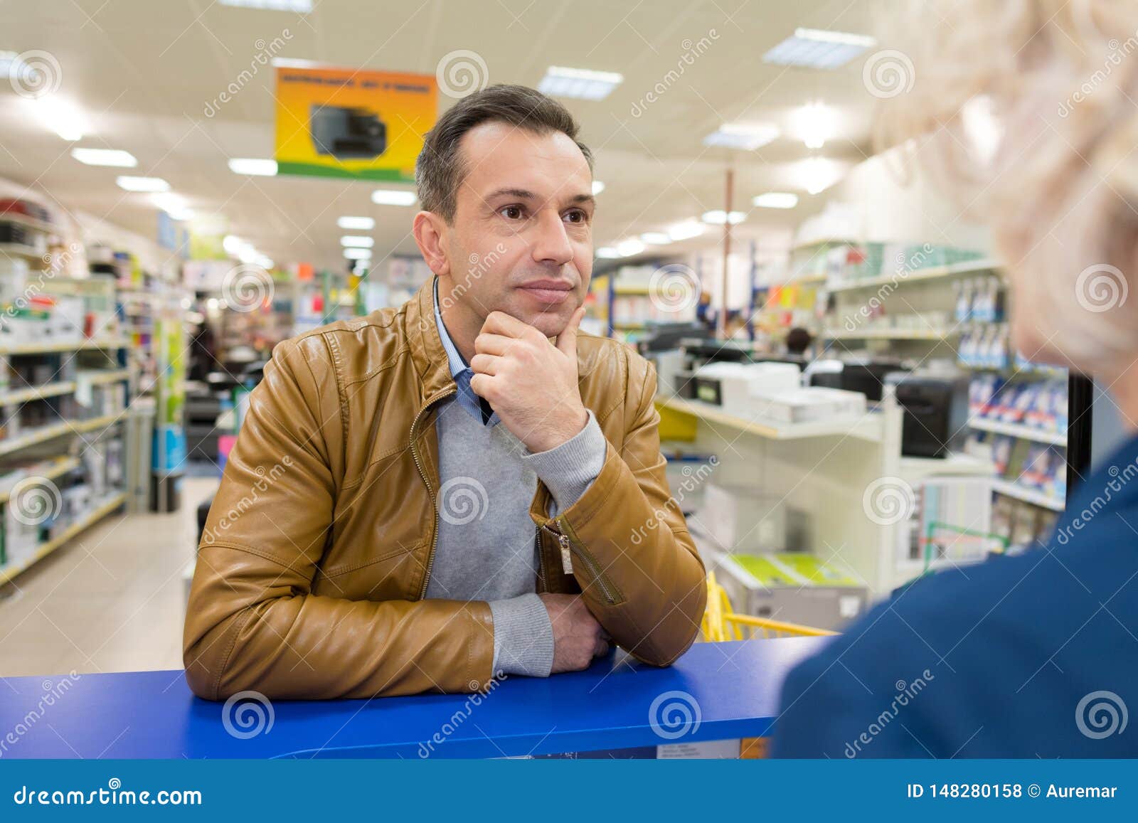 Man at Counter Stationary Shop Stock Photo - Image of conversation ...