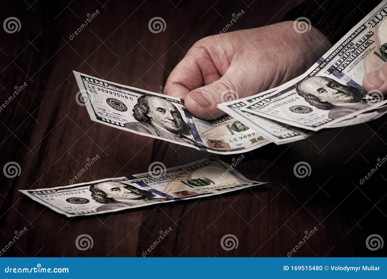 A Man is Counting Money in a Dark Room. Greed Concept_ Stock Photo ...