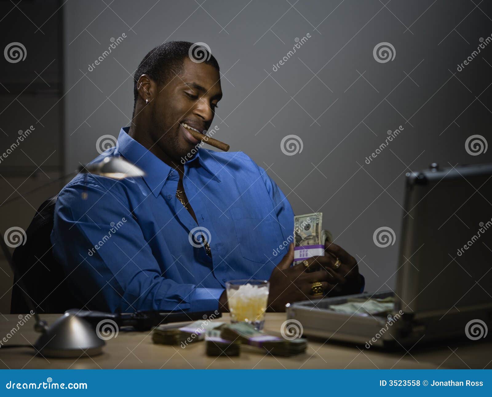 Man counting money at desk stock photo. Image of dessent - 3523558