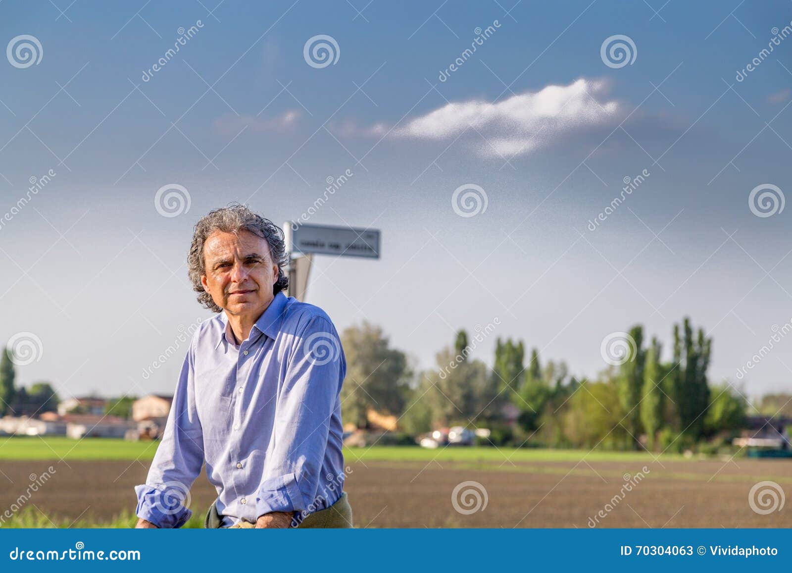 Man in the countryside stock image. Image of rolled, senior - 70304063