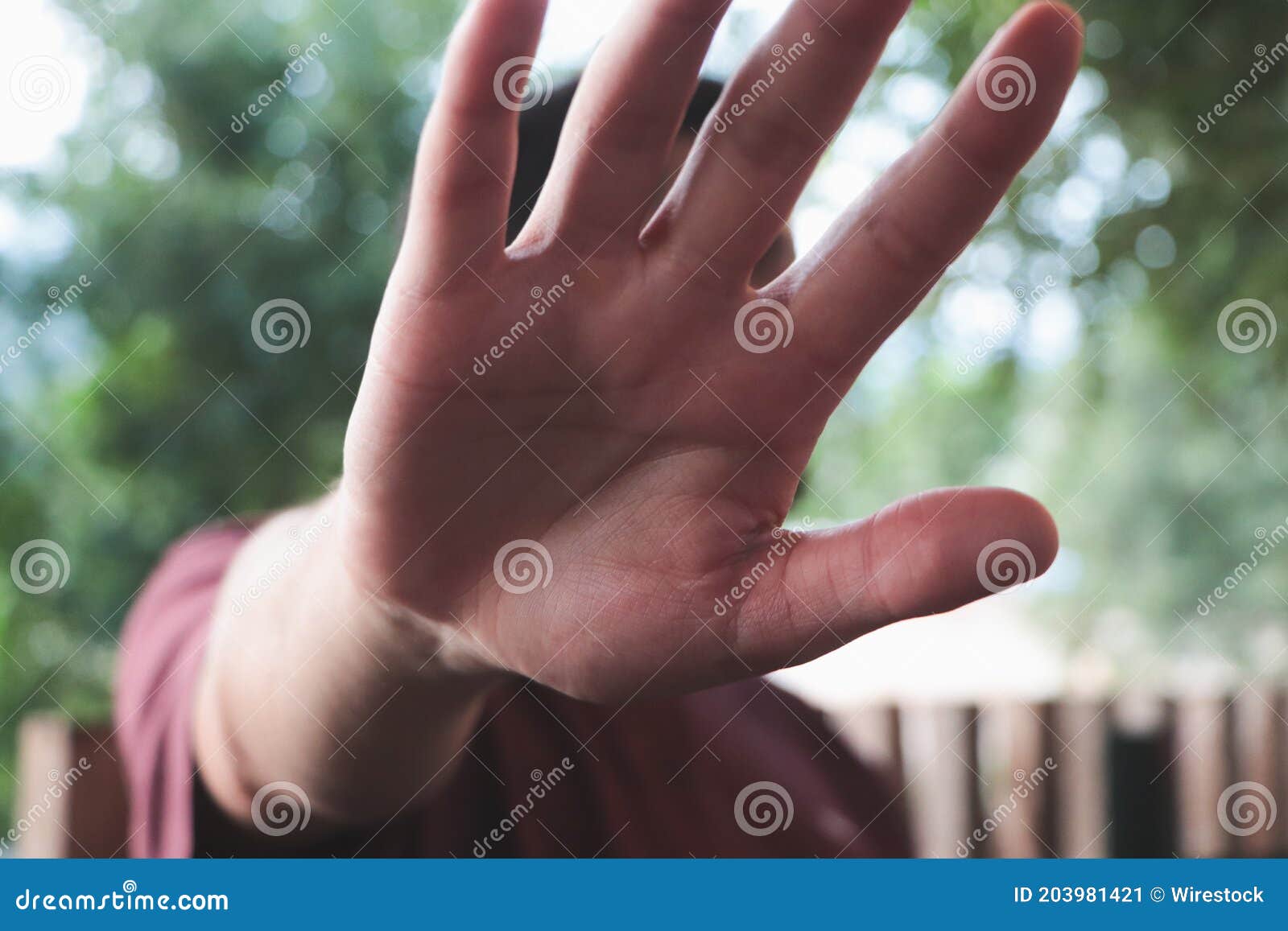 Man Covering the Face from the Camera by His Hand, the Concept of ...