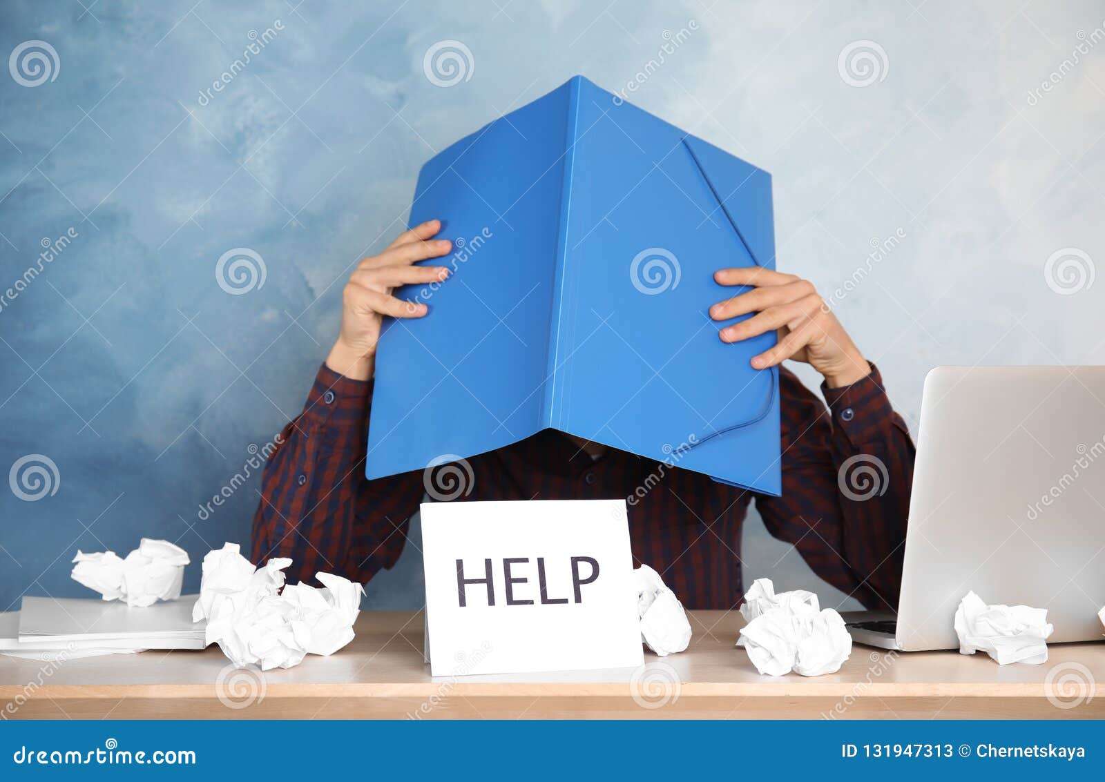 Man Covering Head with Folder at Table in Office Stock Image - Image of ...