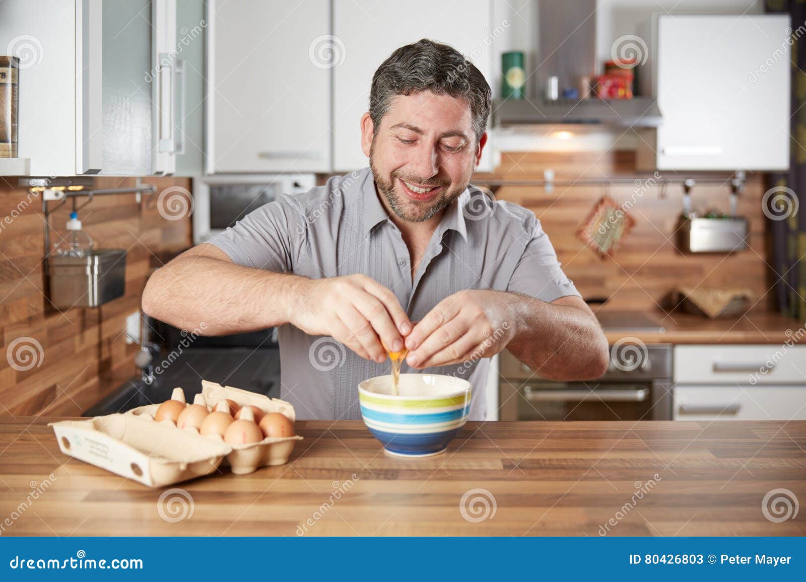 Man Cracking Egg in the Kitchen for Cooking Stock Image - Image of ...