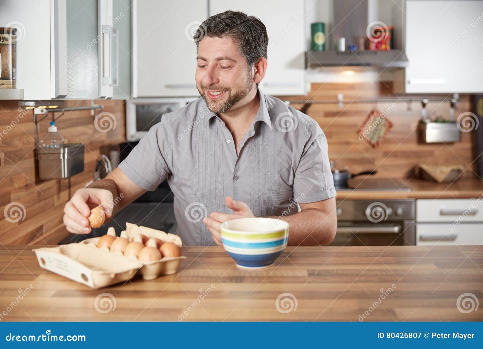 Man Cracking Egg in the Kitchen for Cooking Stock Image - Image of ...