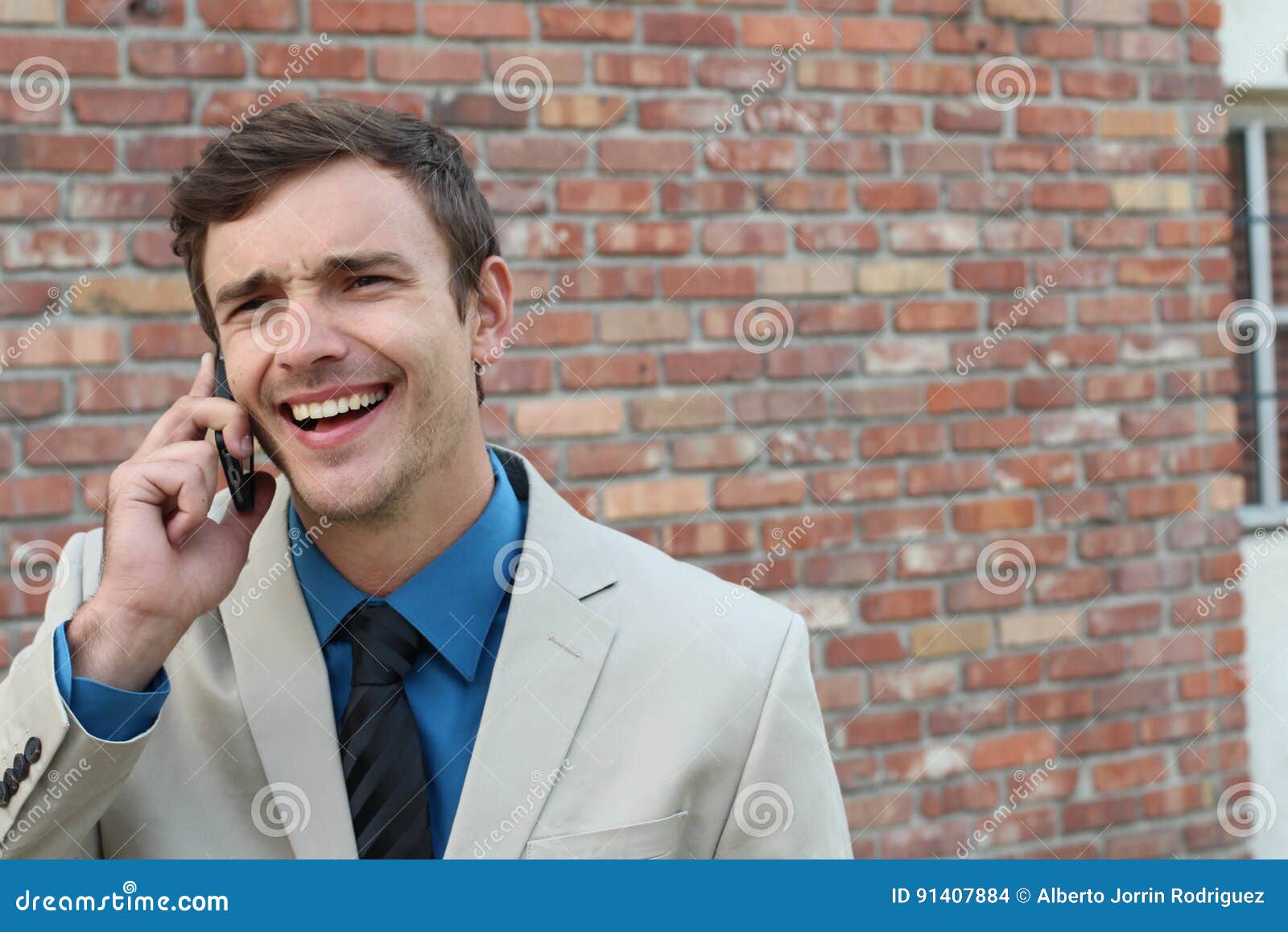 Man Cracking Up after Listening To Joke on Mobile Phone Stock Photo ...