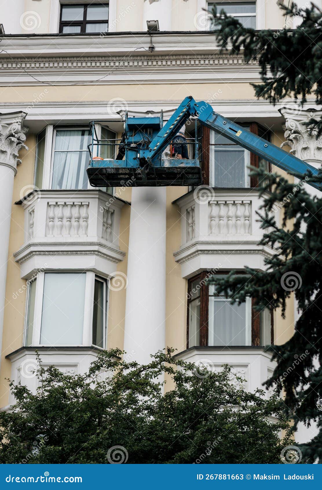 Man in cradle stock image. Image of high, repair, industrial - 267881663