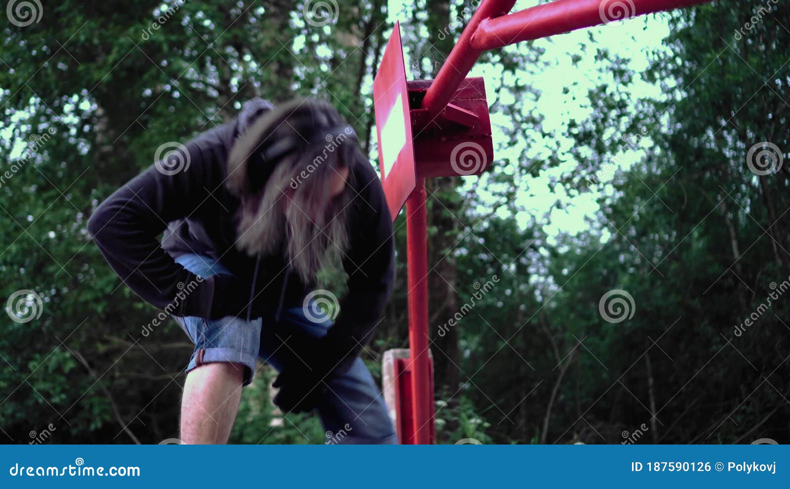 A Man Crawls Under the Gate Blocking His Way. Side View Stock Footage ...