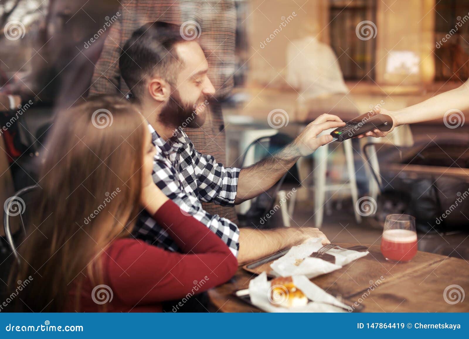 Man with Credit Card Using Payment Terminal at Restaurant Stock Image ...