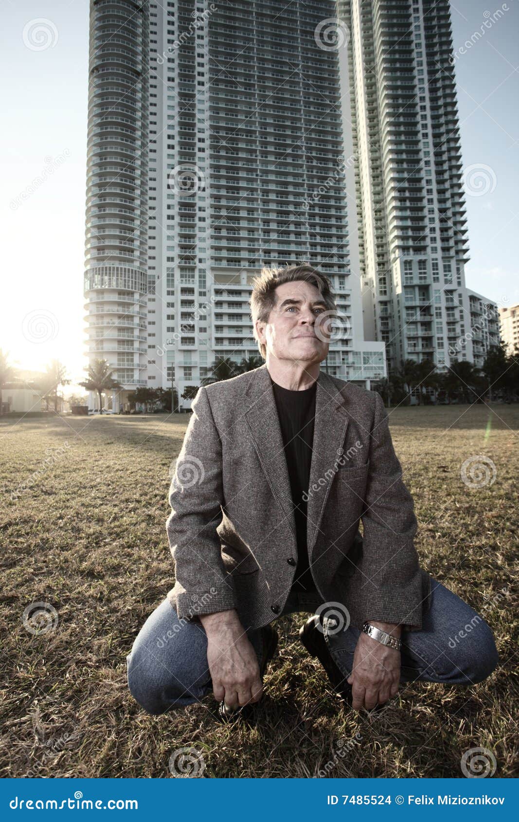 Man crouching and smiling stock photo. Image of leisure - 7485524