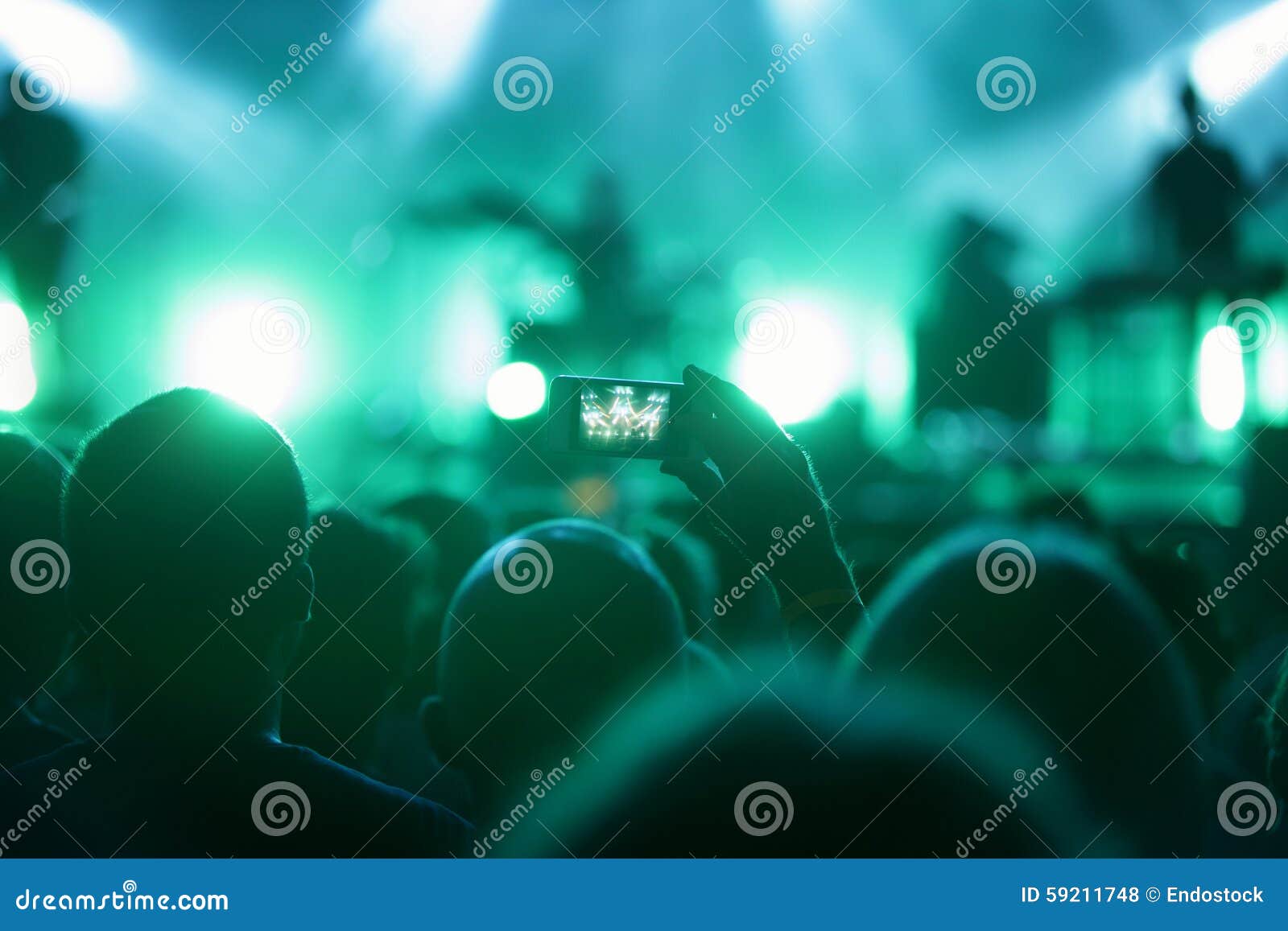 Man in Crowd with Smart Phone Recording Concert Stock Photo - Image of ...