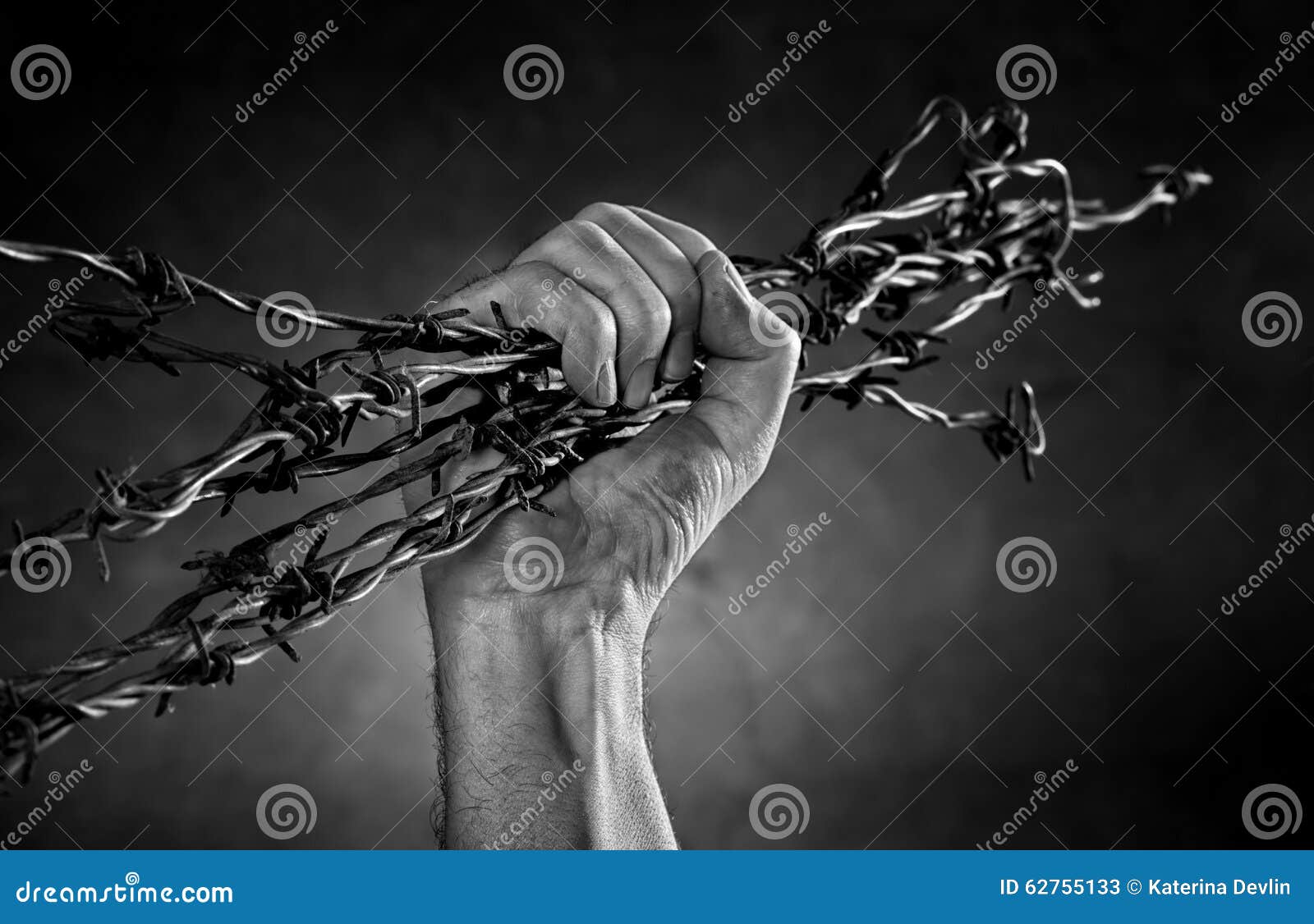 Man crushes barbed wire stock image. Image of rebellion - 62755133