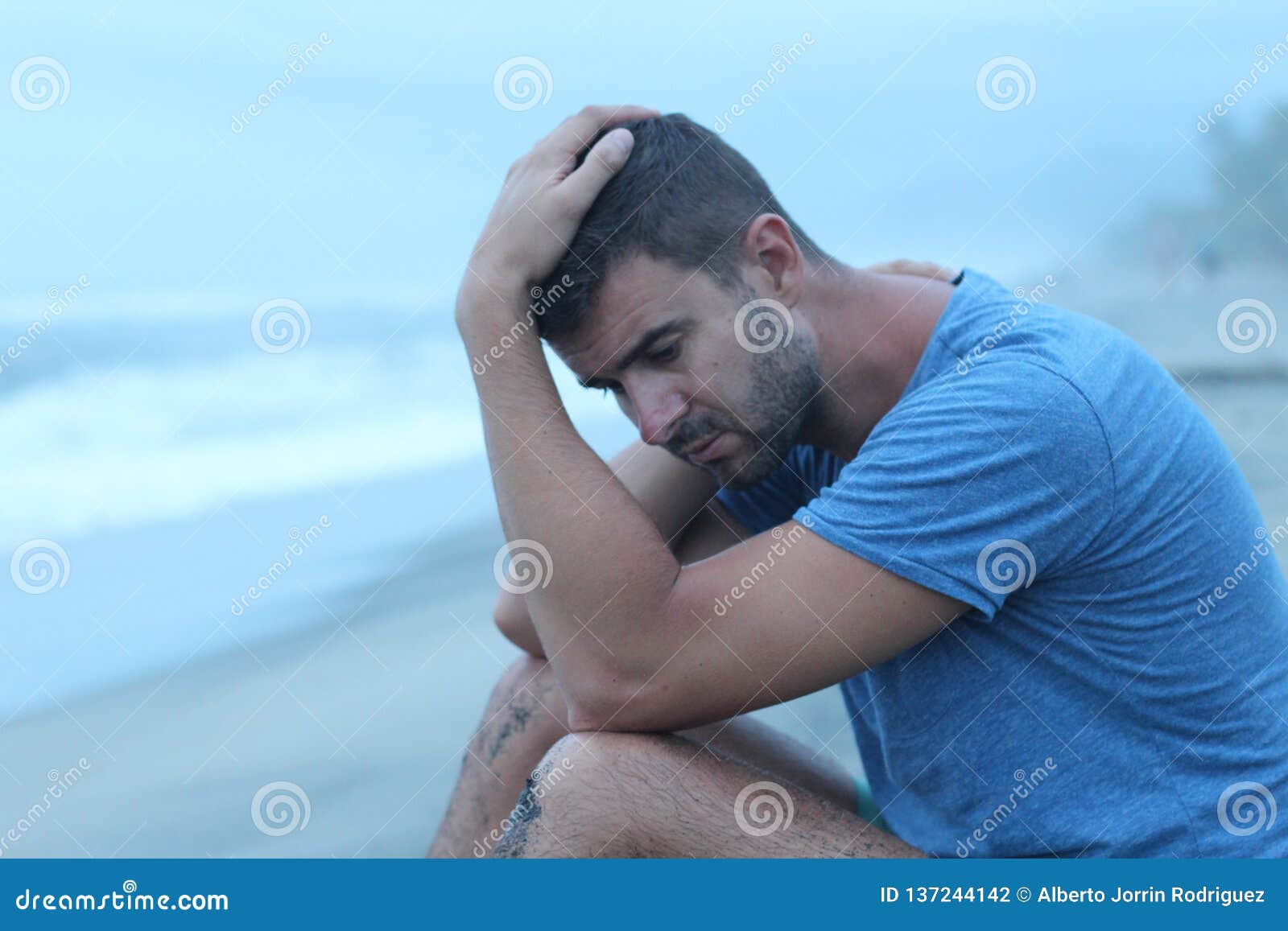 Man crying at the beach stock photo. Image of heartbroken - 137244142