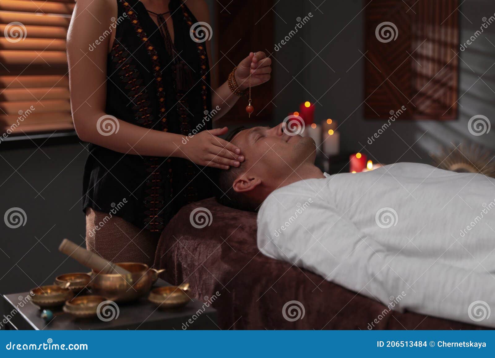 Man at Crystal Healing Session in Dark Room Stock Photo - Image of ...