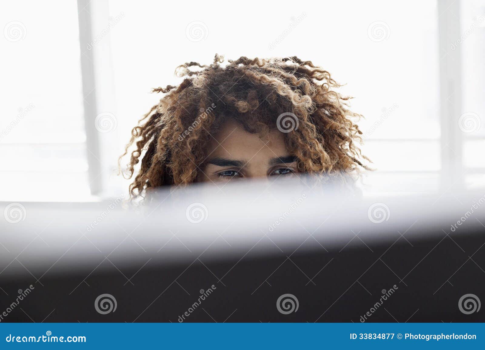Man with Curly Hair Using Computer Stock Image - Image of adult ...