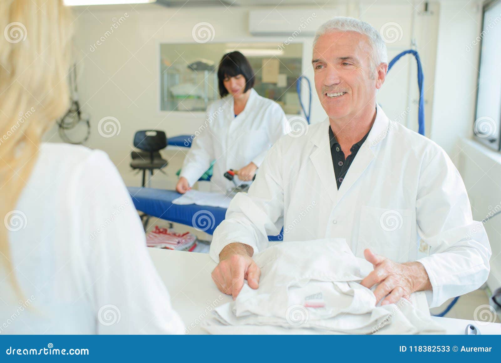 Man with Customer in Professional Laundry Stock Image - Image of ...