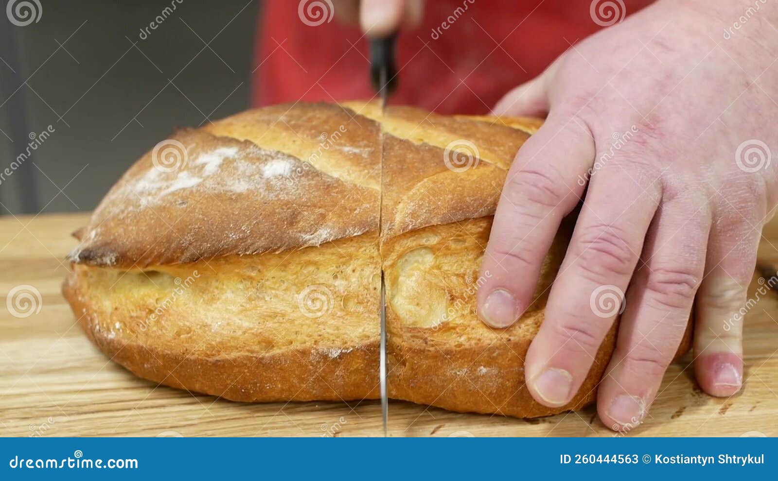 Man Cut a Fresh Crispy Wheat Bread in Half Stock Video - Video of ...