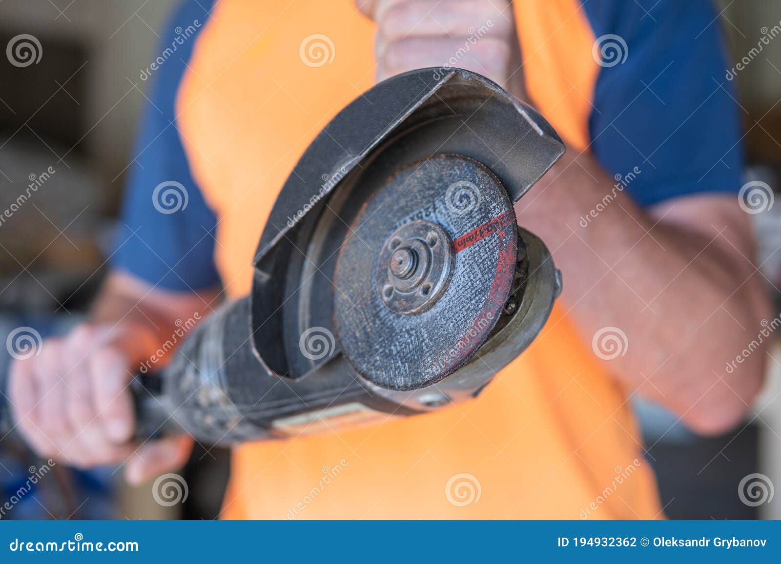 Man with a cut grinder stock photo. Image of hand, person - 194932362