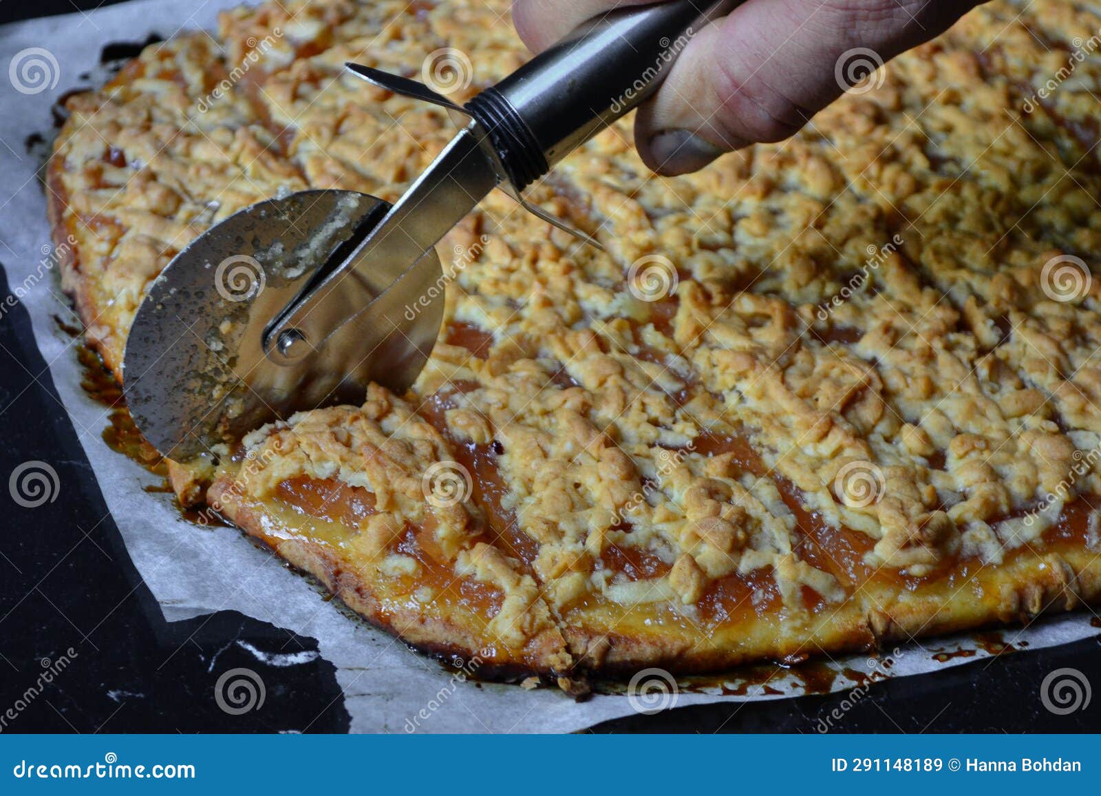 A Man Cuts a Grated Cake on the Table with a Knife Stock Image - Image ...