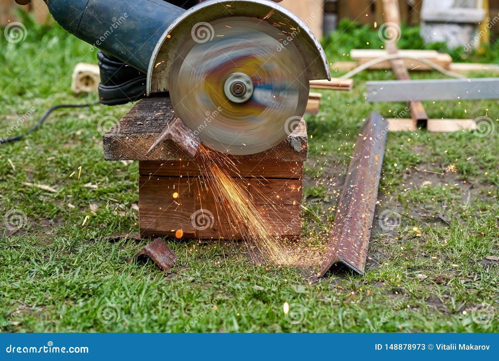 A Man Cuts a Metal Profile with a Disk Tool Stock Image - Image of ...