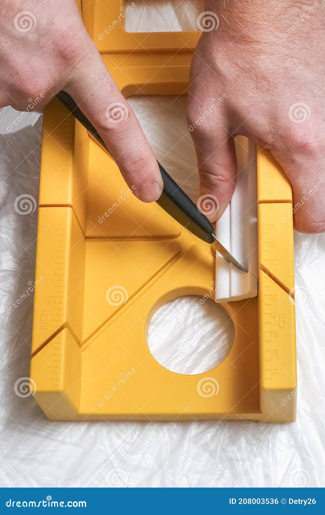 The Man Cuts Off the Molding Cornice on Miter Box. Stock Photo - Image ...