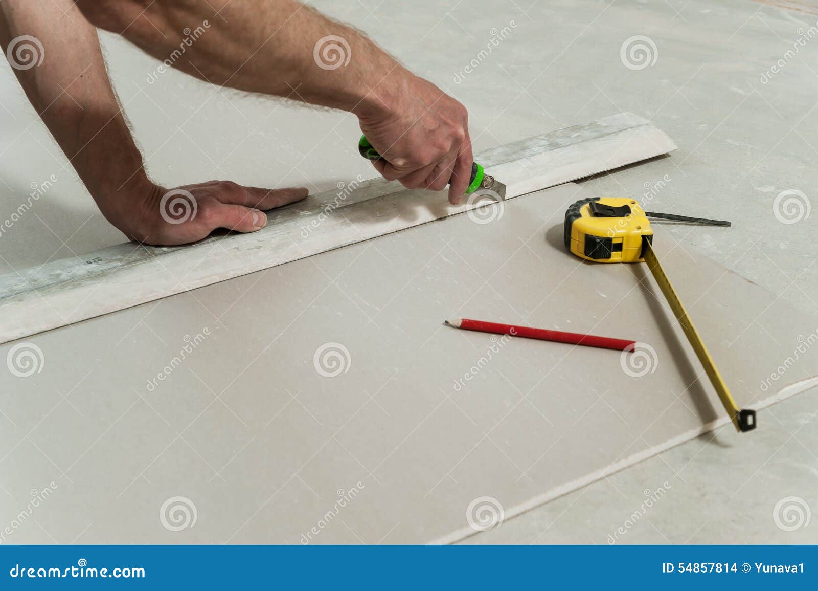 Man Cuts Off a Piece of Drywall Stock Photo - Image of ceiling, house ...