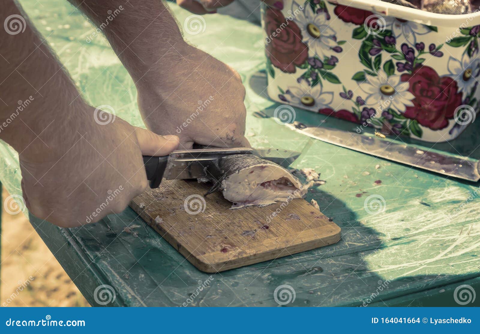 A Man Cuts into Pieces Fresh River Fish Stock Photo - Image of cooking ...