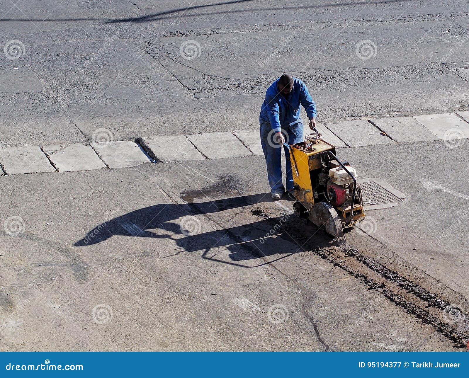 Man Cutting Asphalt with Machine Editorial Photography - Image of ...