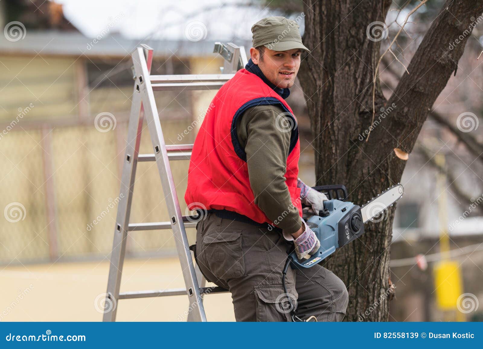 Man Cutting a Branch with Chainsaw in the Yard Stock Image - Image of ...