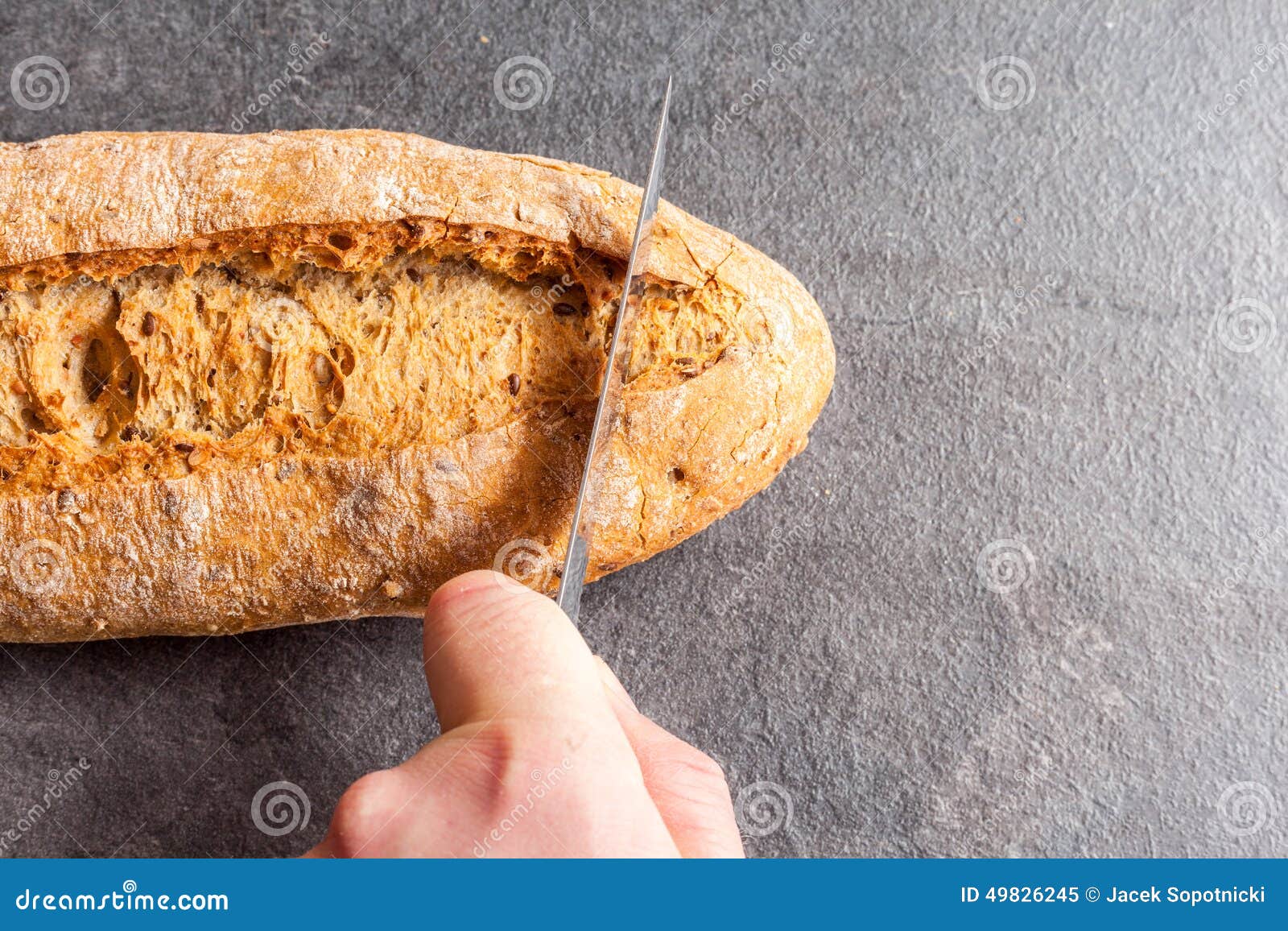 Man cutting a bread stock image. Image of meal, grain - 49826245