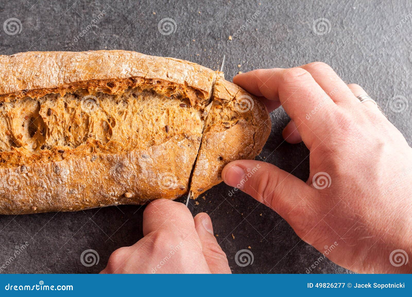 Man cutting a bread stock image. Image of bakery, crust - 49826277