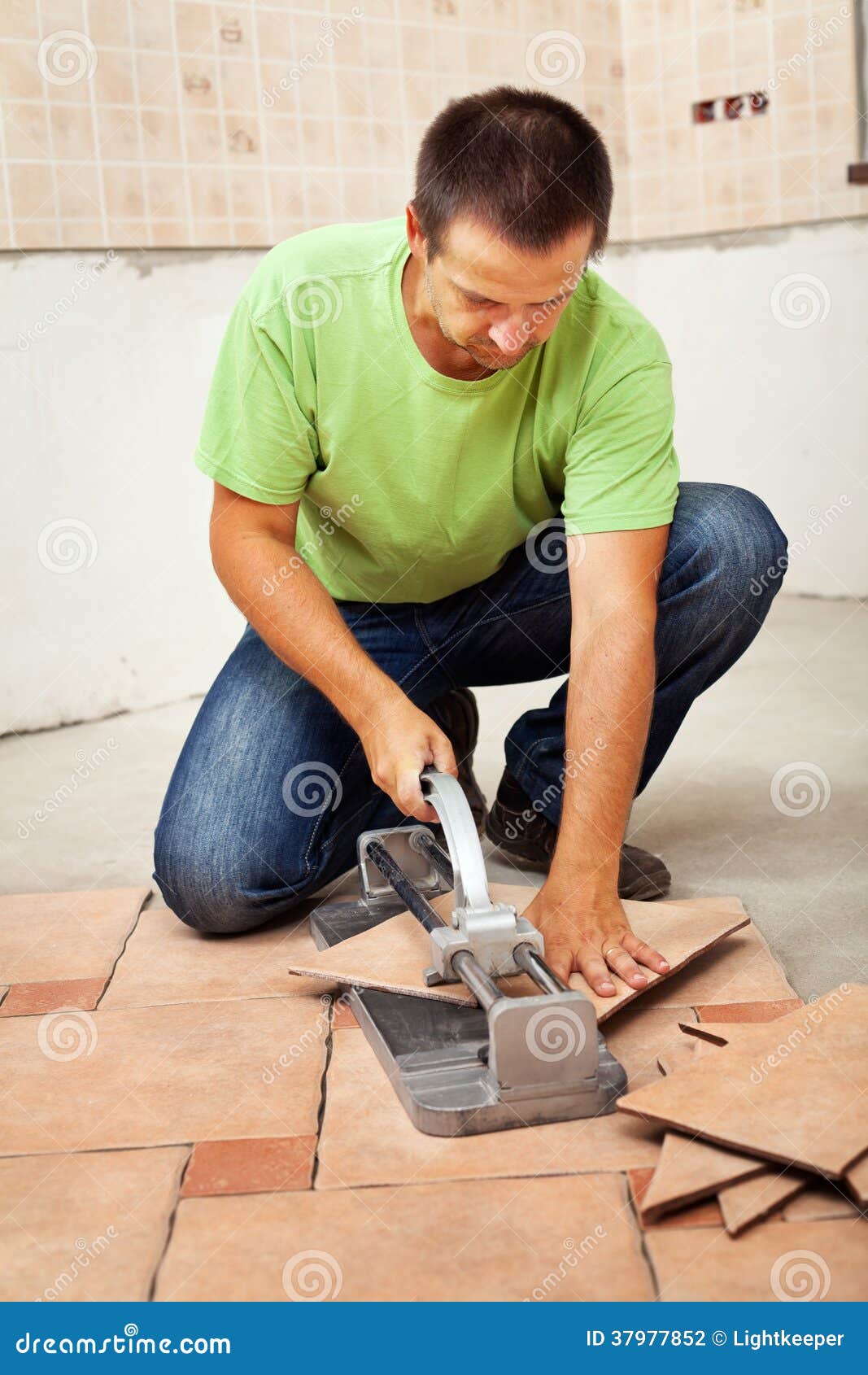 Man Cutting Ceramic Floor Tiles Stock Photo - Image of repair, tiles ...