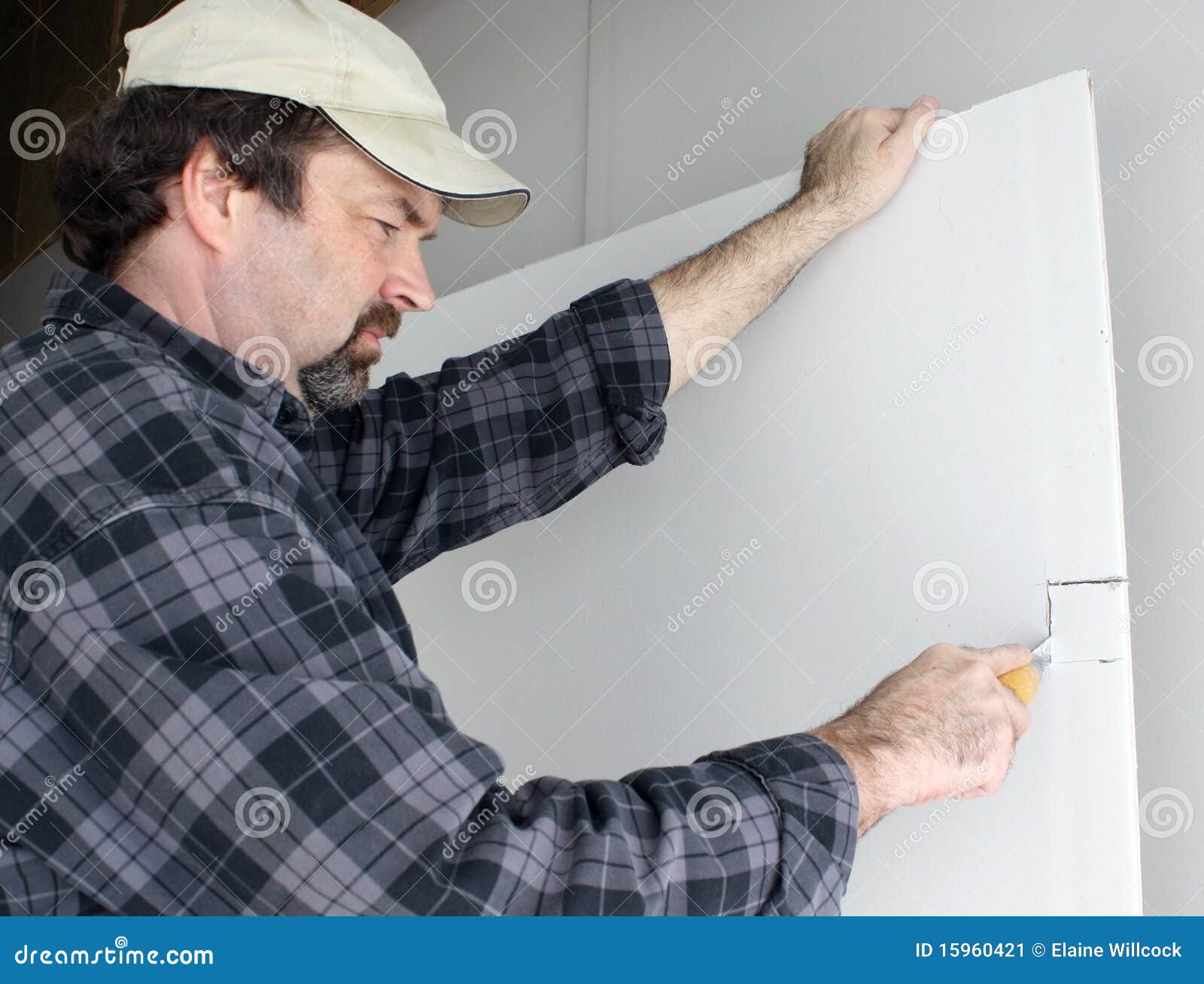 Man cutting drywall stock image. Image of fitting, renovations - 15960421