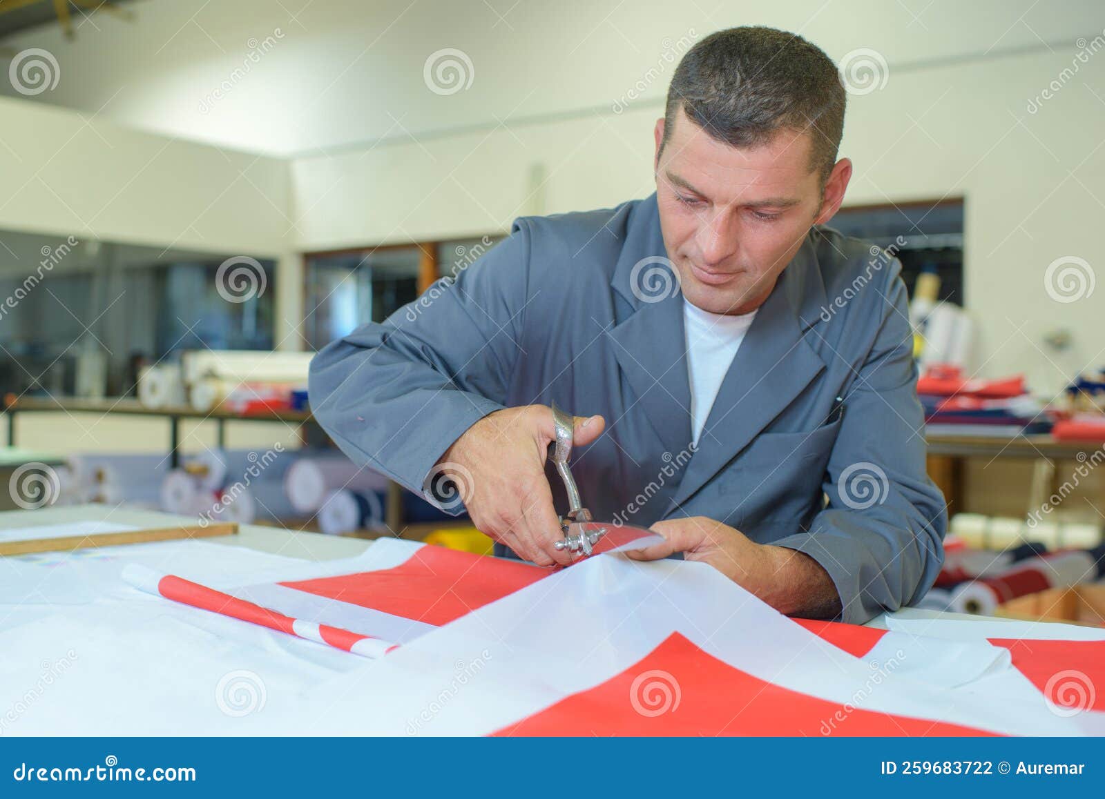 Man cutting fabric stock photo. Image of fabric, printed - 259683722