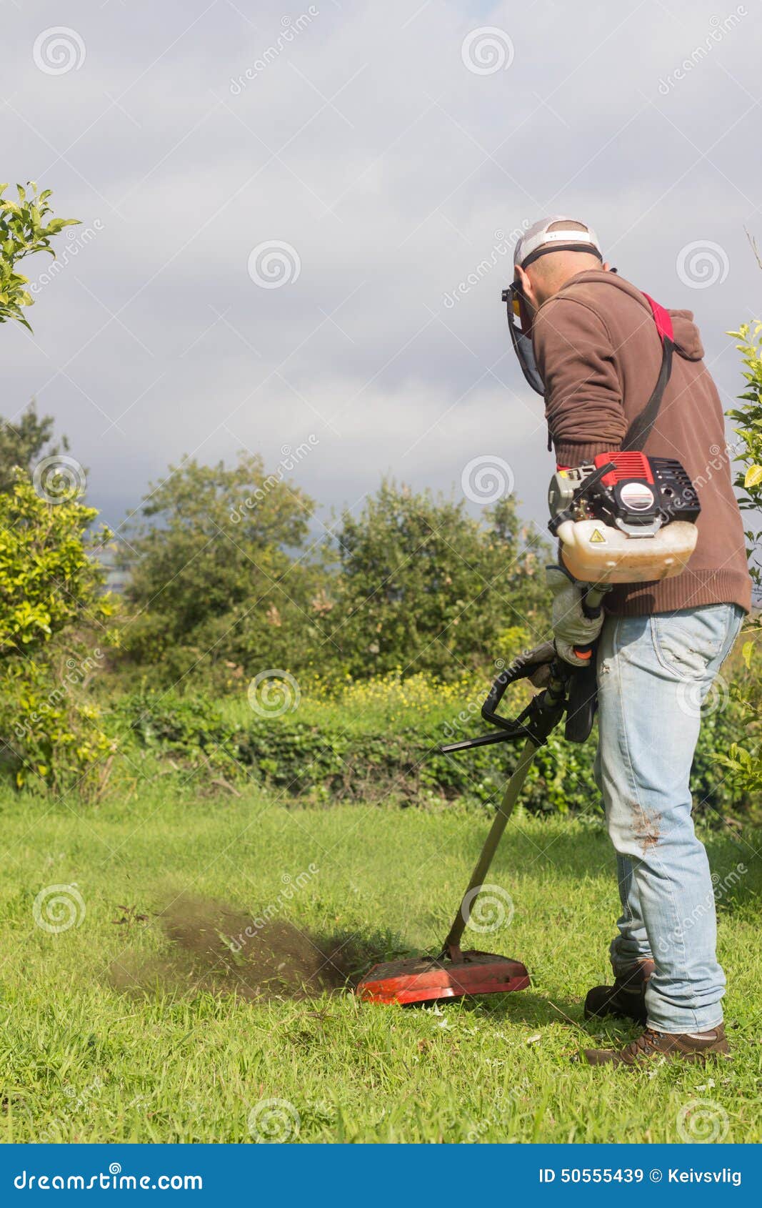 Man cut grass stock image. Image of gardener, vertical - 50555439