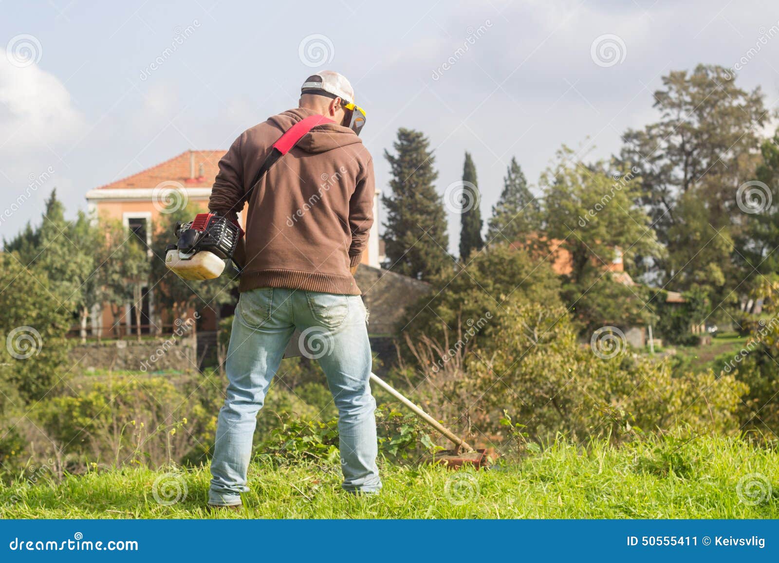 Man cutting grass stock image. Image of spring, house - 50555411