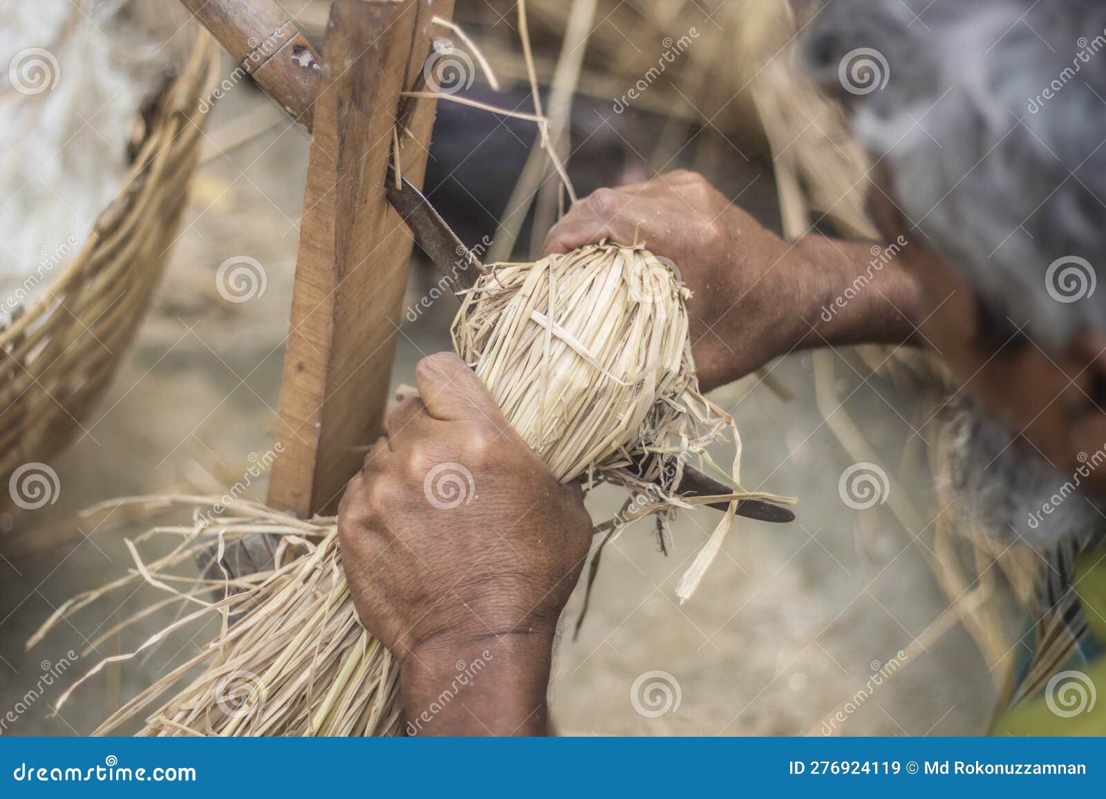 A Man is Cutting Hay with Scissors with His Two Hands Stock Image ...