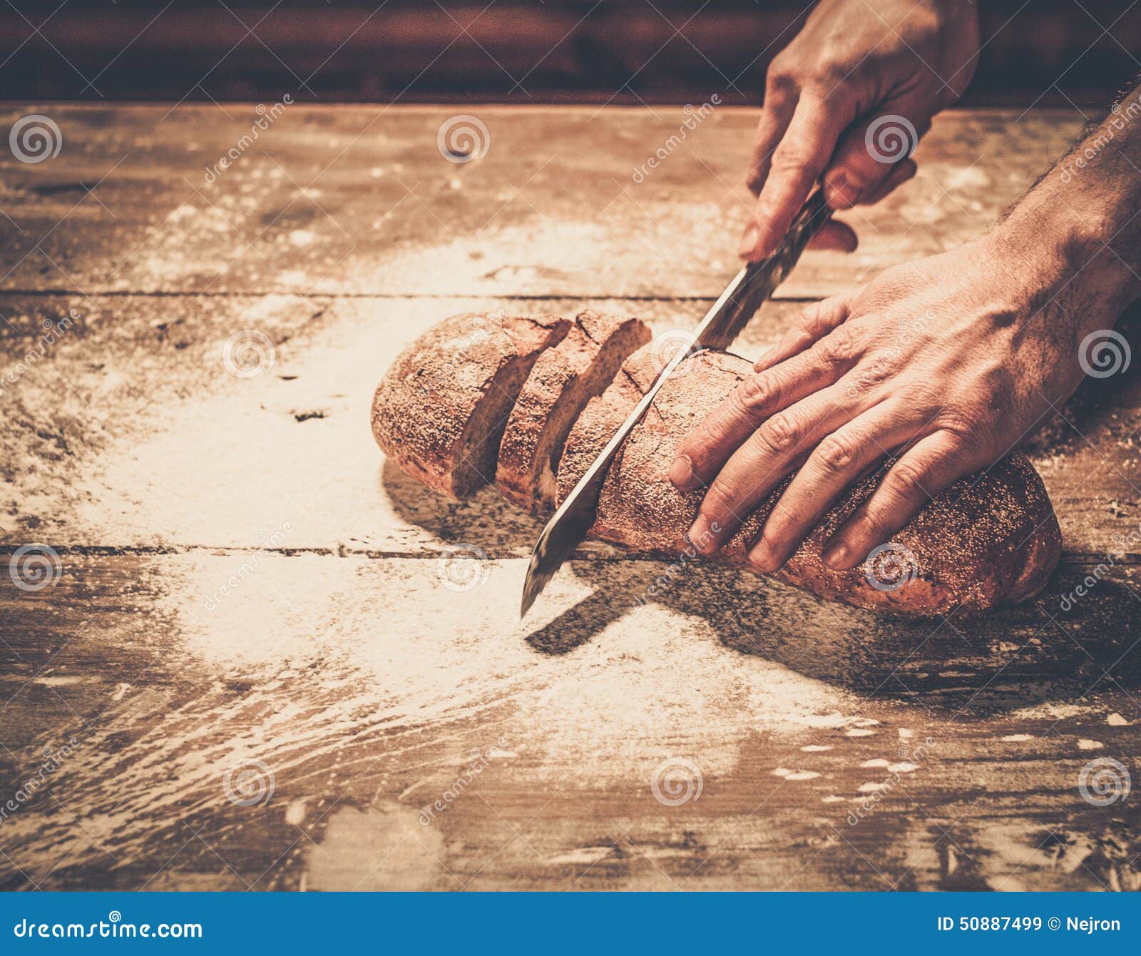 Man cutting homemade bread stock image. Image of making - 50887499