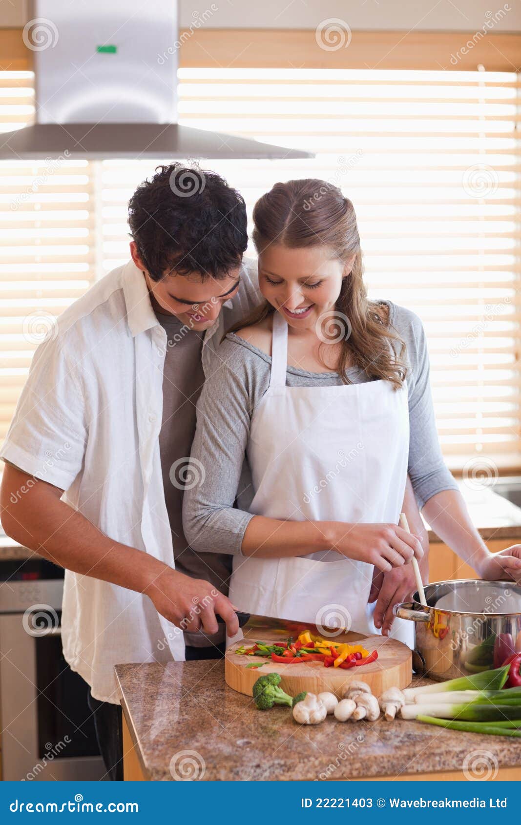 Man Cutting Ingredients To Help His Girlfriend Stock Image - Image of ...