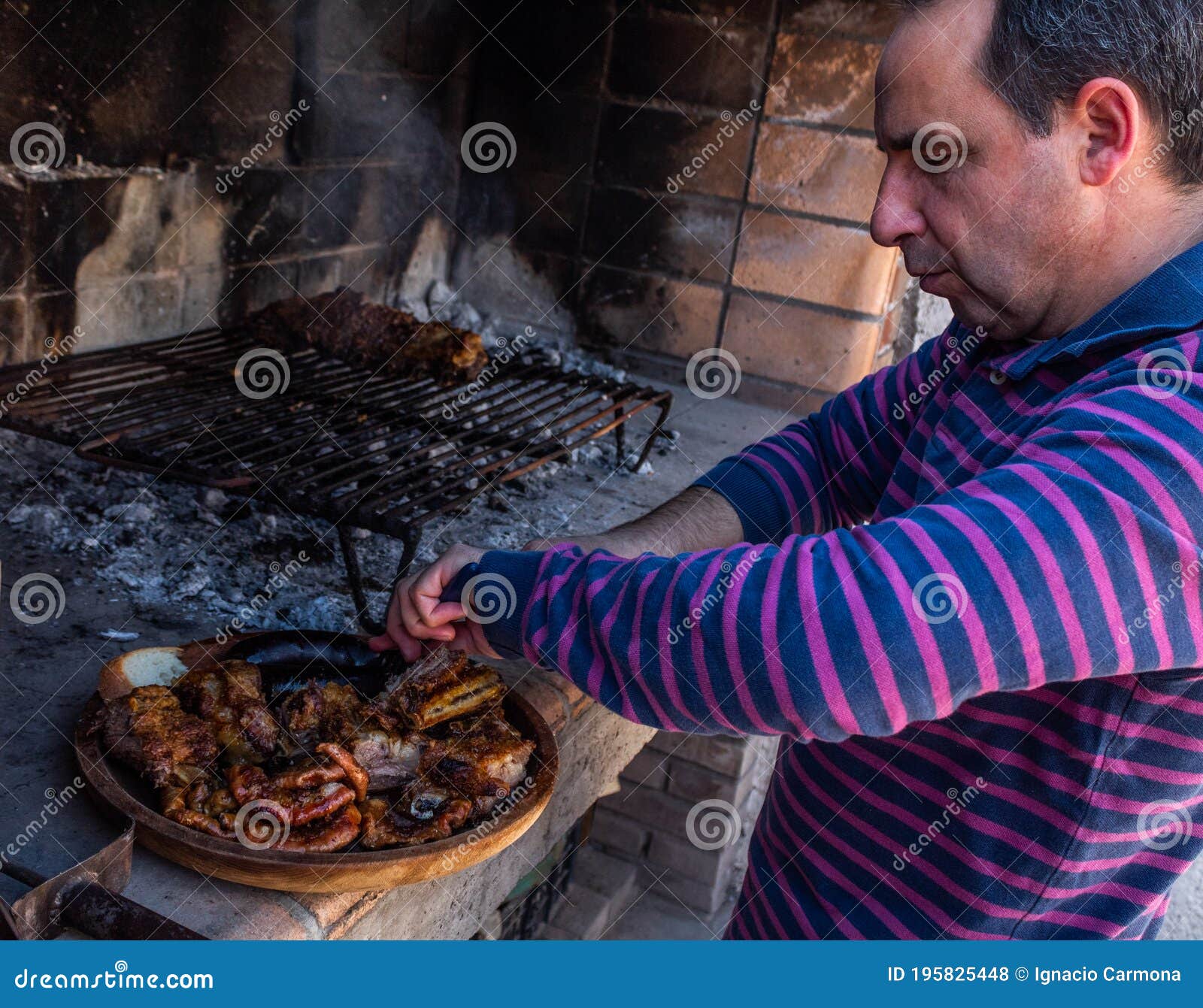 Man Cutting Meat on Wooden Dish Stock Photo - Image of charcoal, house ...