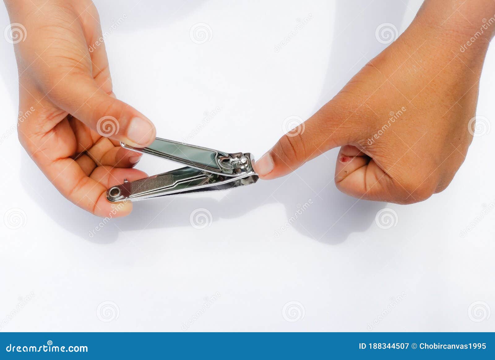 The Man Cutting the Nails on White Background. Stock Image - Image of ...