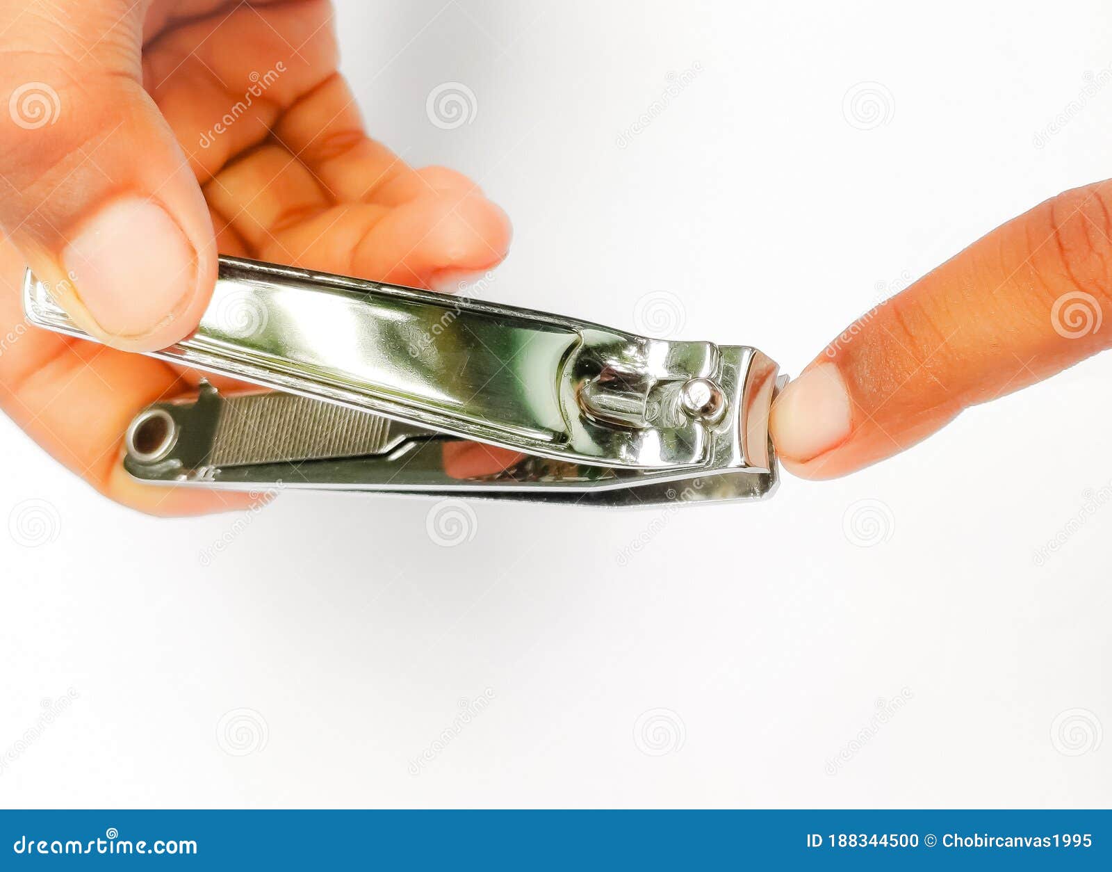 The Man Cutting the Nails on White Background. Stock Photo - Image of ...