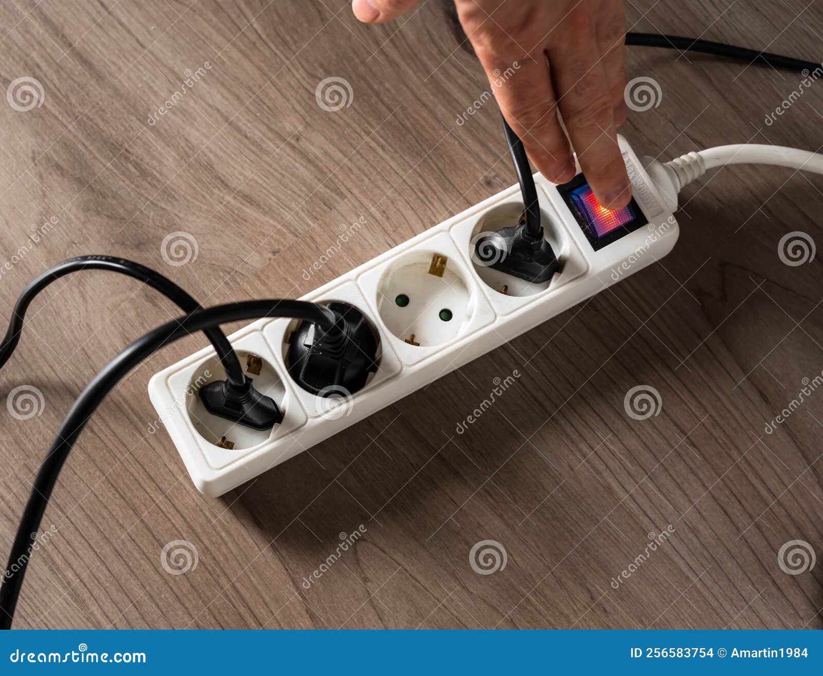 A Man Cutting Off the Electrical Current by Turning Off the Button on a ...