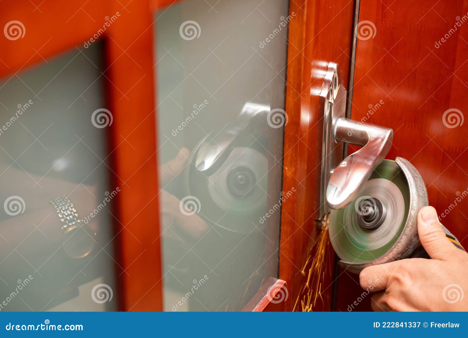 A Man Cutting Out a Door Lock by a Grinder Stock Image - Image of ...