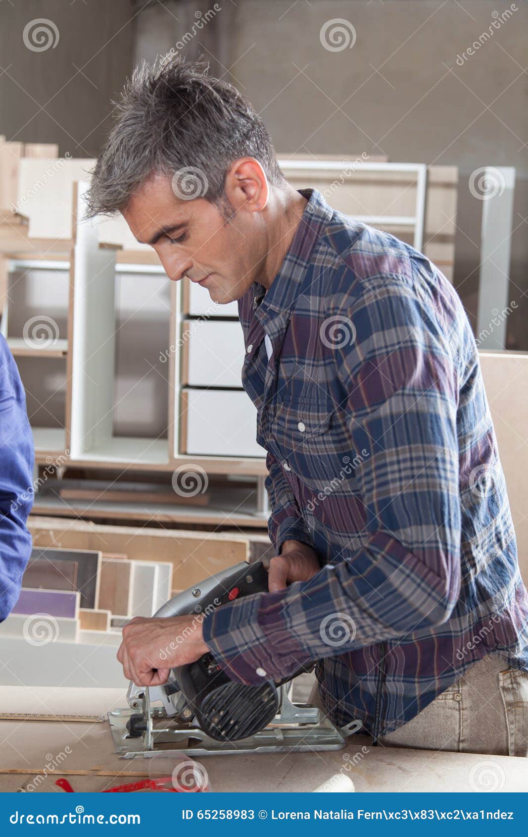 Man Cutting a Piece of Wood Stock Image - Image of wooden, repair: 65258983