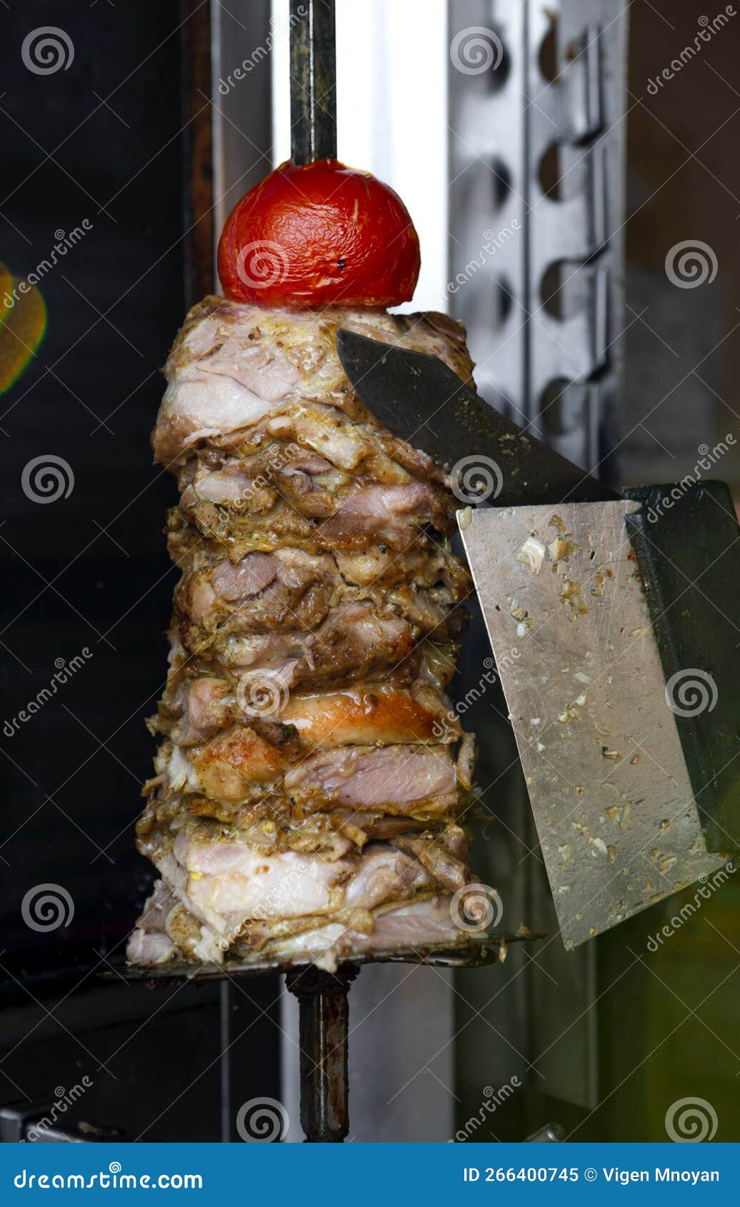 Man cutting prepared meat stock image. Image of meal - 266400745