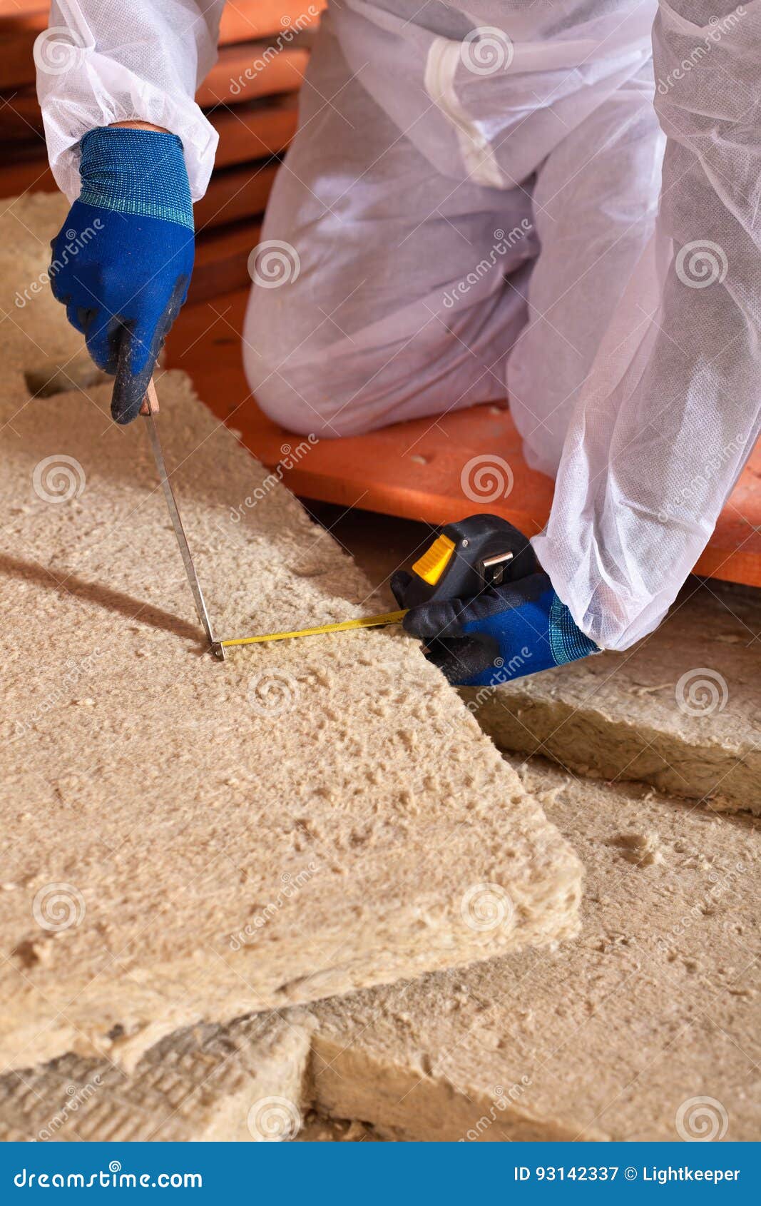Man Cutting Rockwool Panel To Fit in Thermal Insulation Layer Stock ...
